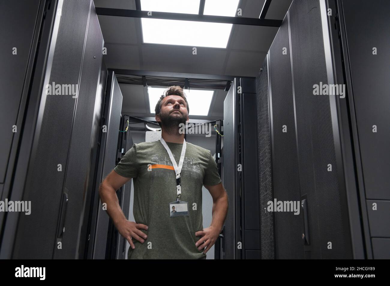 Portrait of male technician or network administrator standing brave as ...