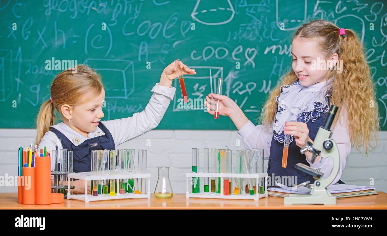 School laboratory partners. Kids busy with experiment. Chemical ...