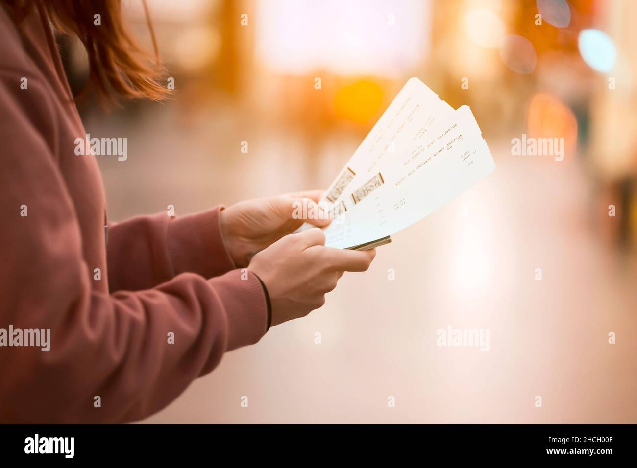 Girl holds tickets, boarding passes for a flight Stock Photo - Alamy