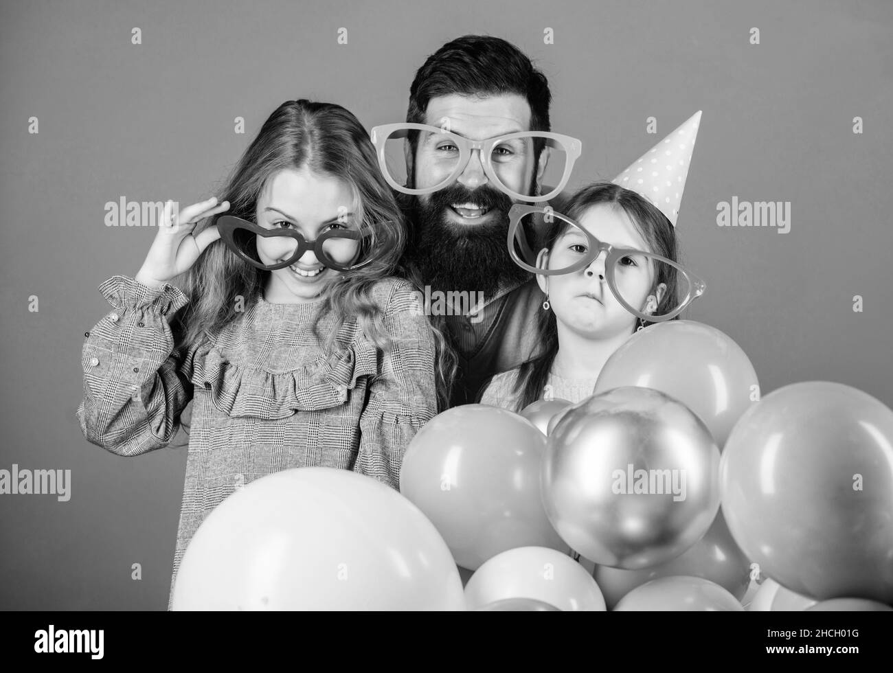 In fancy style. Father and girl children enjoying party time. Happy ...