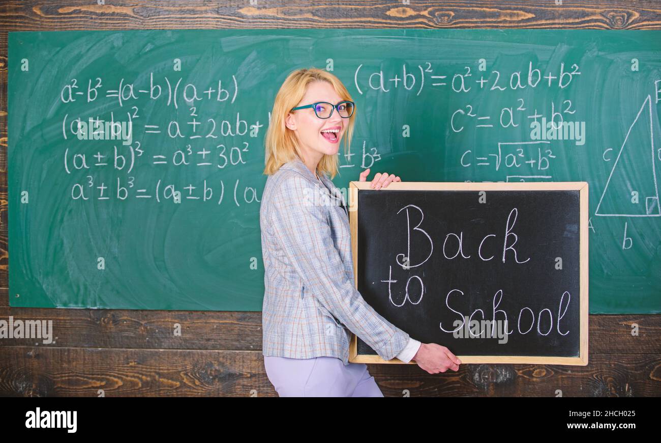 It is school time again. School teacher glad to welcome pupils. Great ...