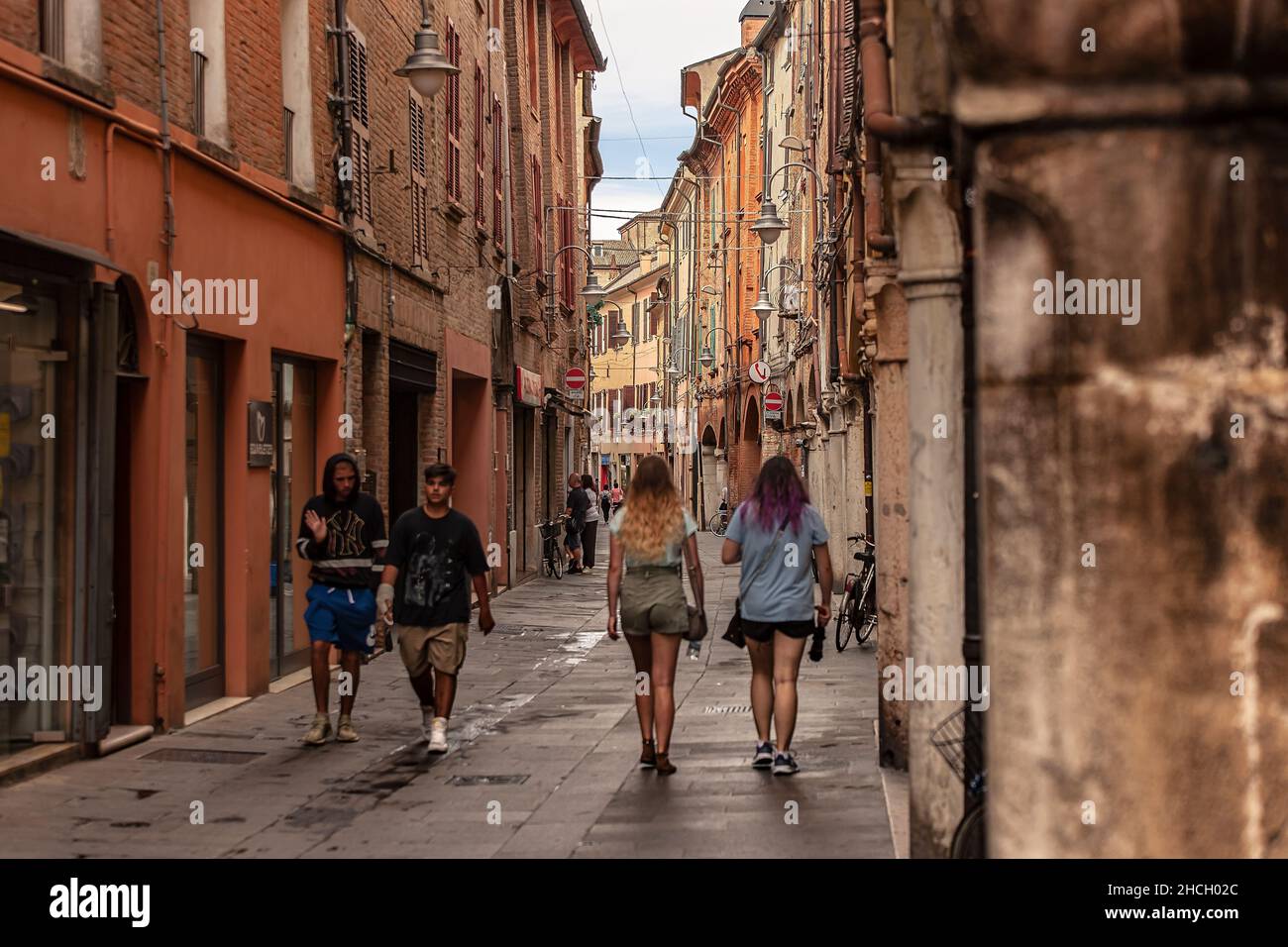 FERRARA, ITALY 29 JULY 2020 : Alley of Ferrara in Italy full of people ...