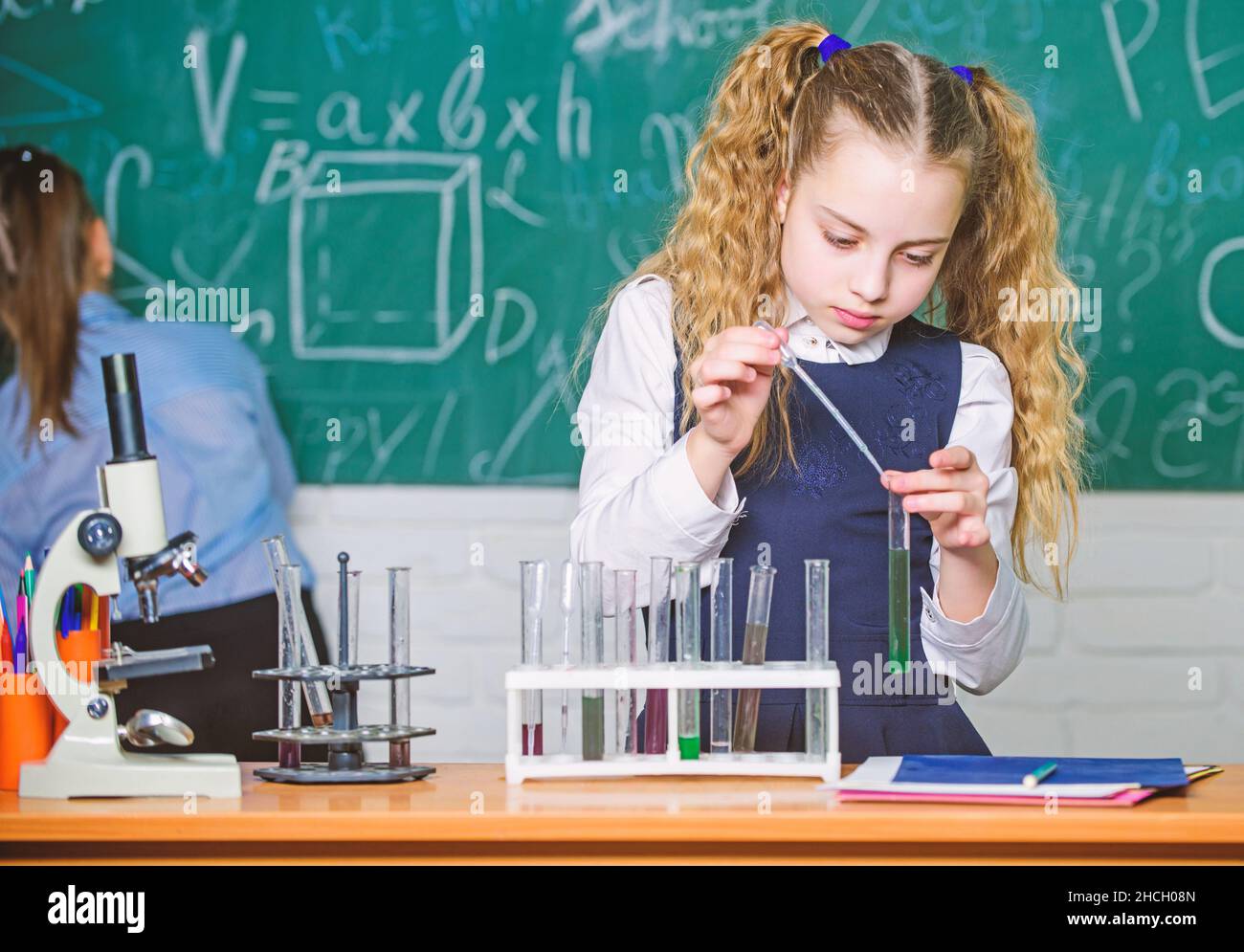 Chemical analysis. School pupil study chemical liquids. School ...