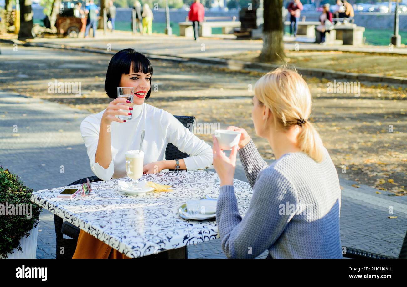 Conversation of two women cafe terrace. Friendship meeting ...