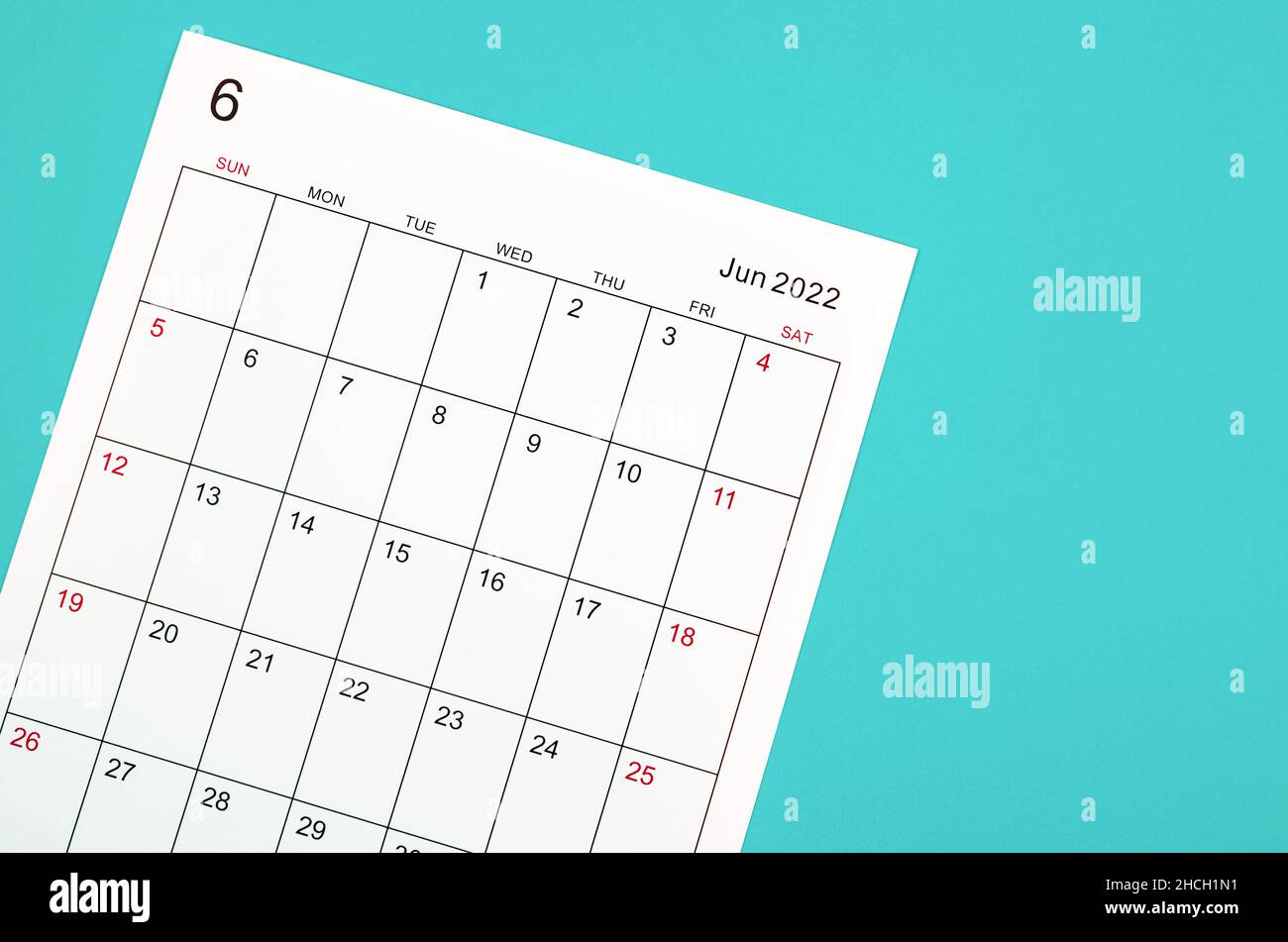 Close up June 2022 calendar sheet on bule background Stock Photo - Alamy