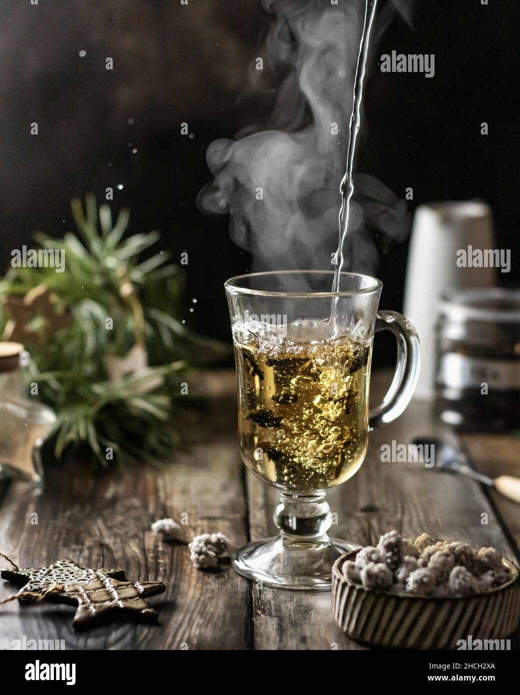 Tea brewing process. A cup of freshly sourced green tea with bubbles ...
