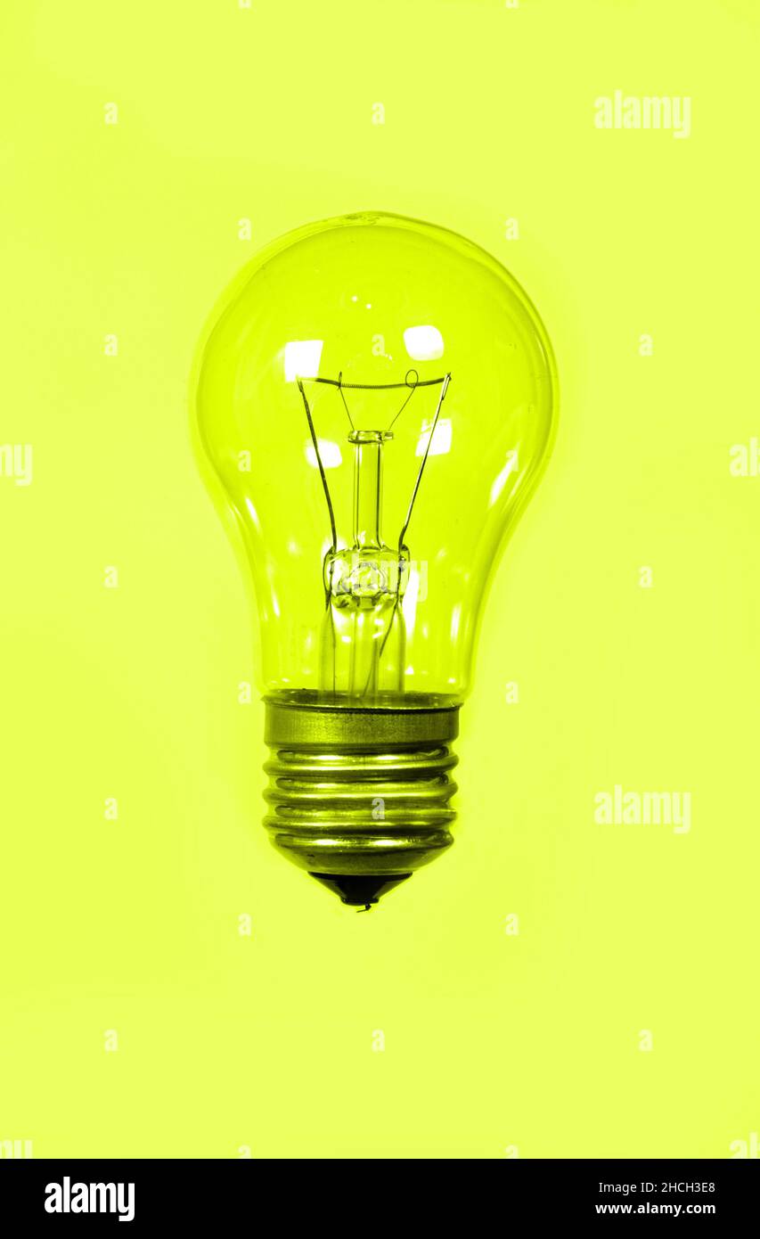 Light bulb on a yellow background Stock Photo - Alamy