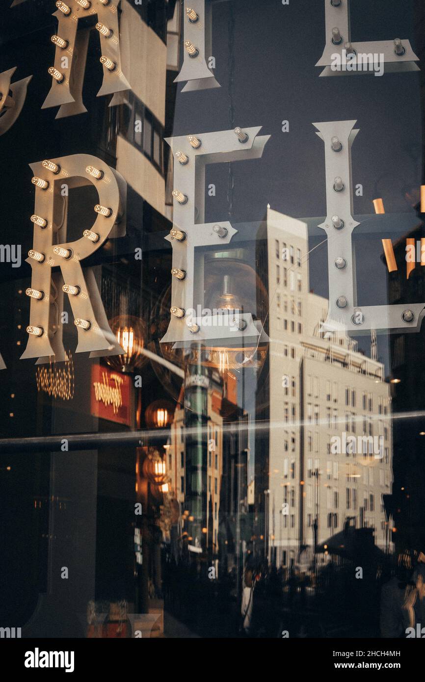 Buildings Seen Through reflection of an illuminated window Stock Photo ...