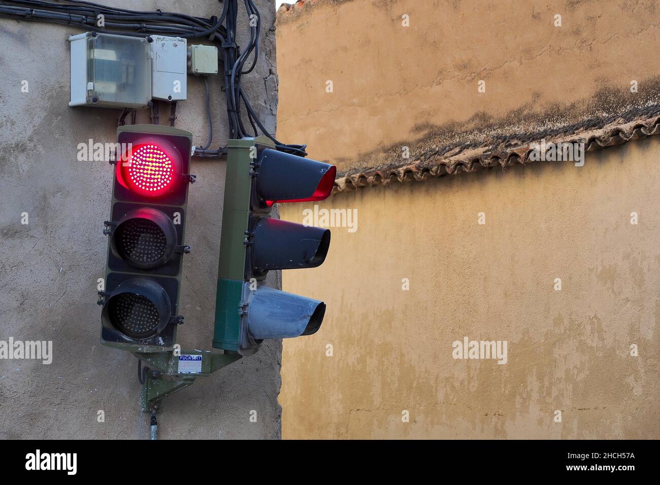 Two traffic lights on red at house wall Stock Photo - Alamy