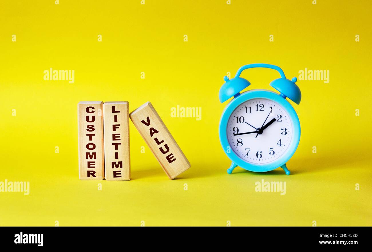 Wooden blocks with the text Customer Lifetime Value, business concept ...