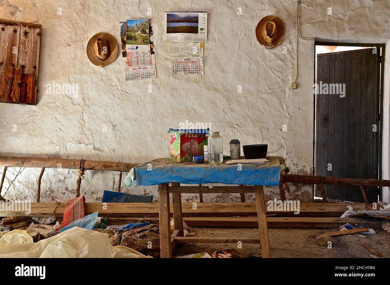 Messy room with table of an abandoned house, Spain Stock Photo - Alamy