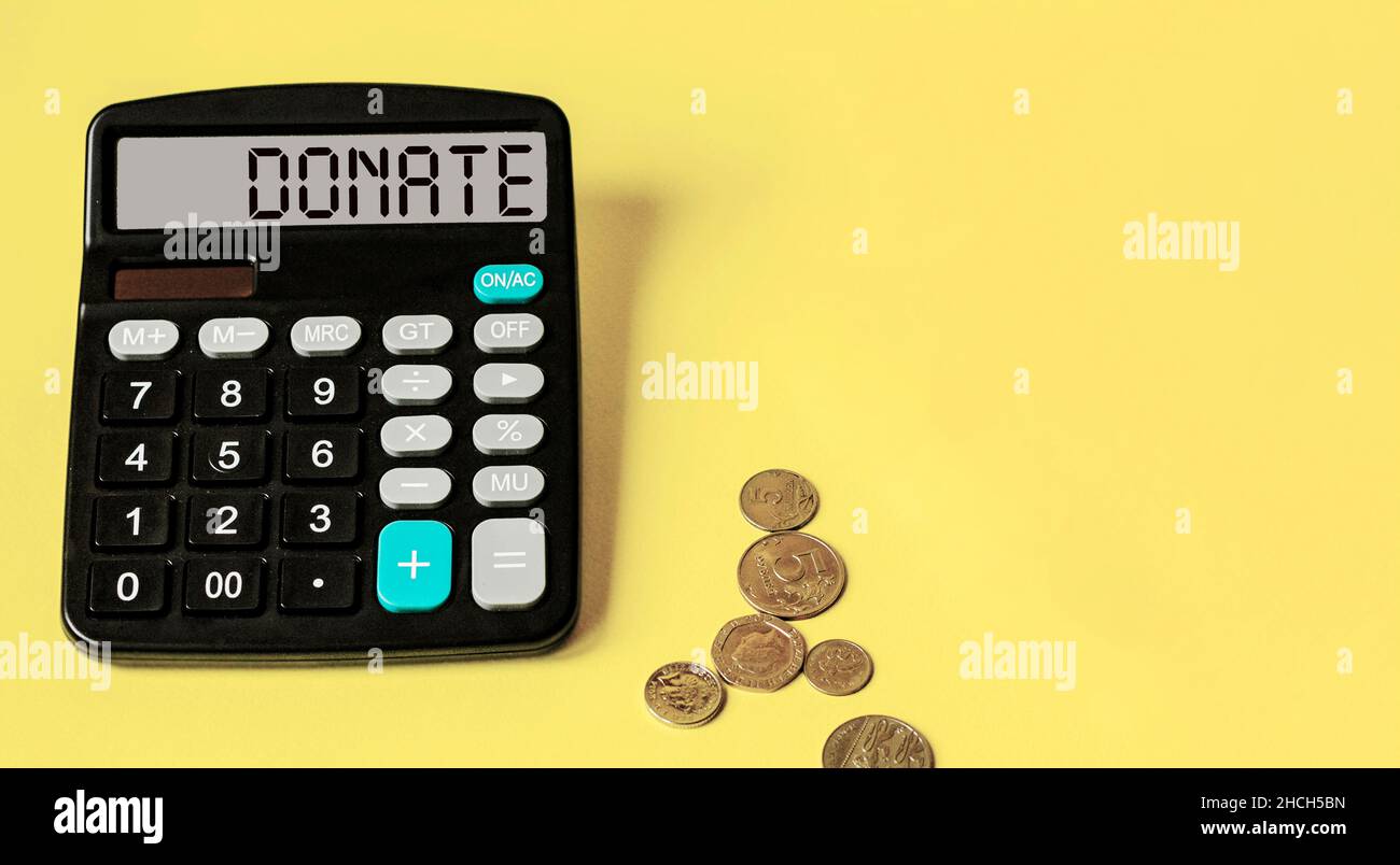 Calculator with the word DONATION on display. Business, tax and ...