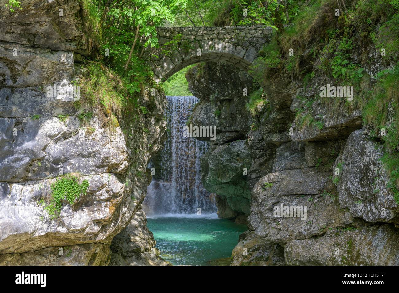 Cascata Rio Repepeit a small artificial waterfall with stone bridge ...