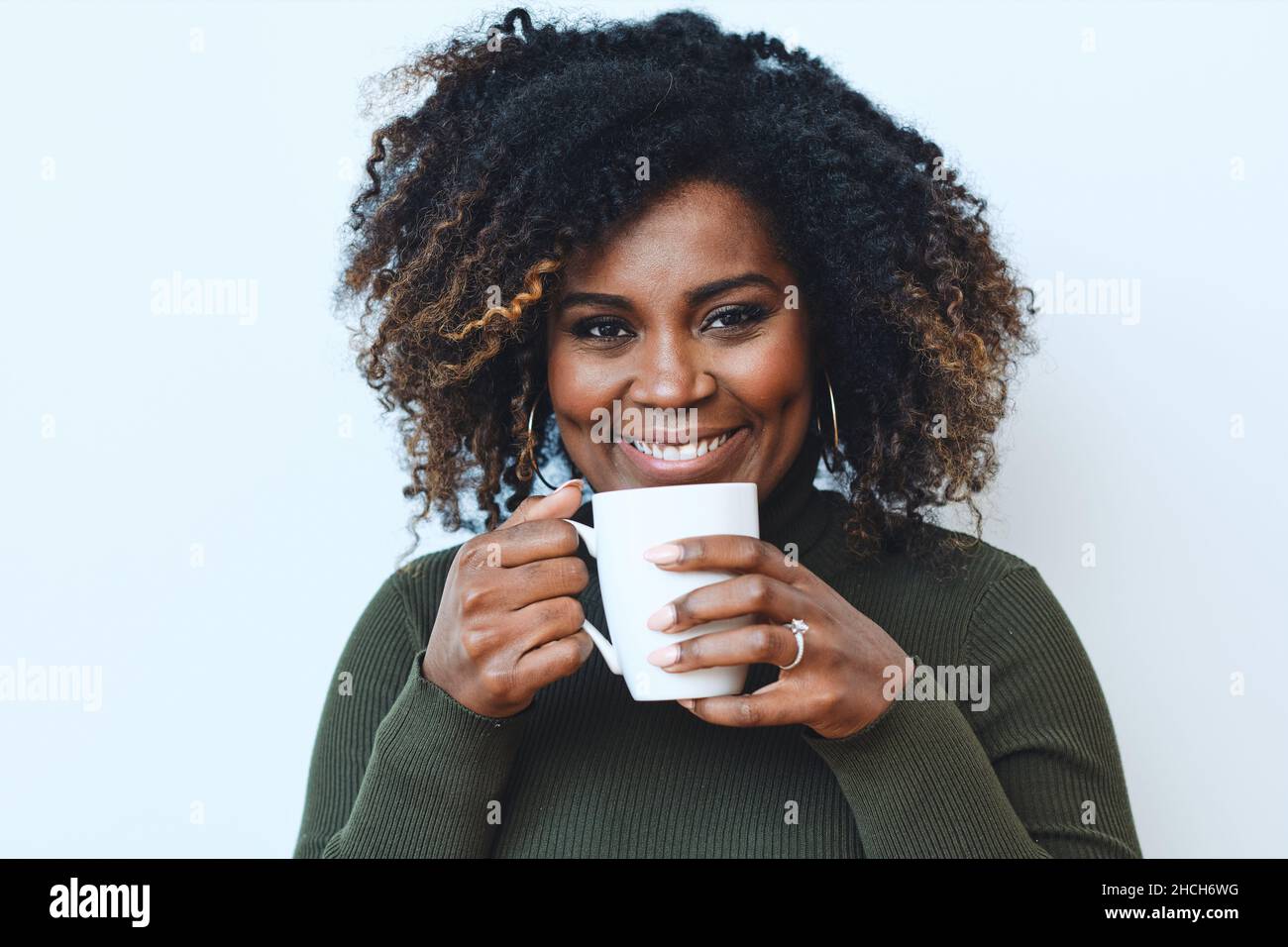Closeup portrait of smiling adult African American Woman drinking ...