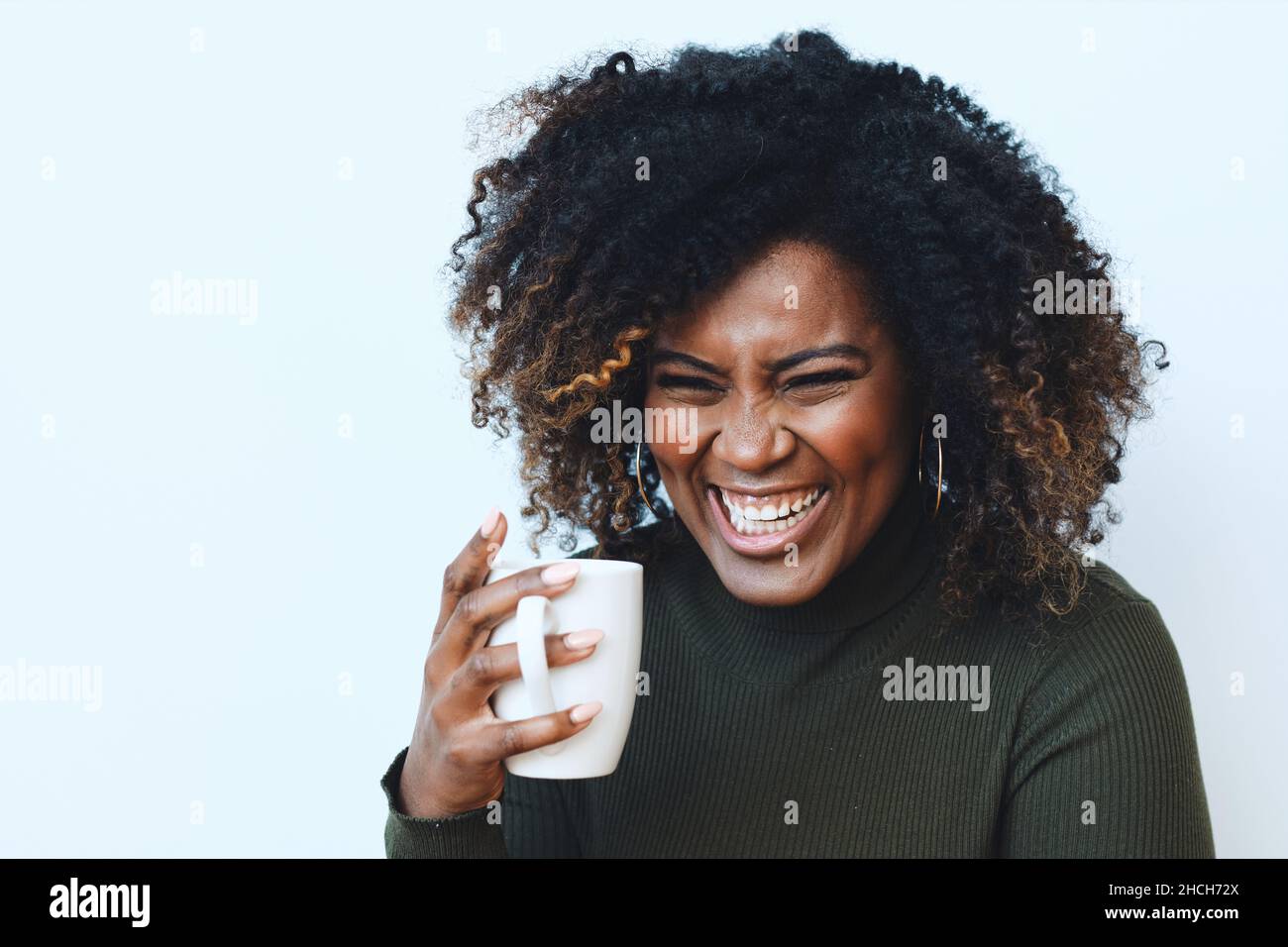 Closeup Smiling African American Black Woman with curly hair holding a ...