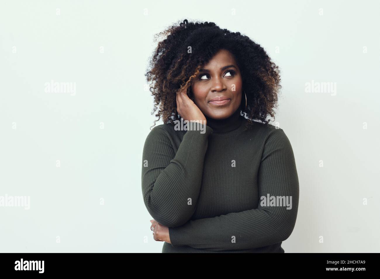 Thoughtful African American Black Woman with curly hair Looking Away at ...