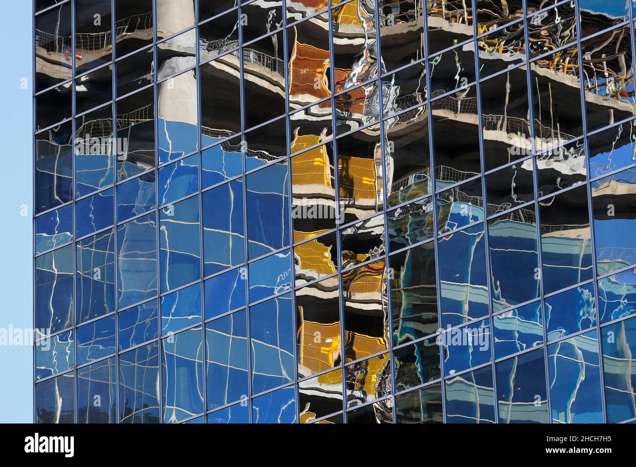 Construction reflection on facade of modern building, Montreal ...