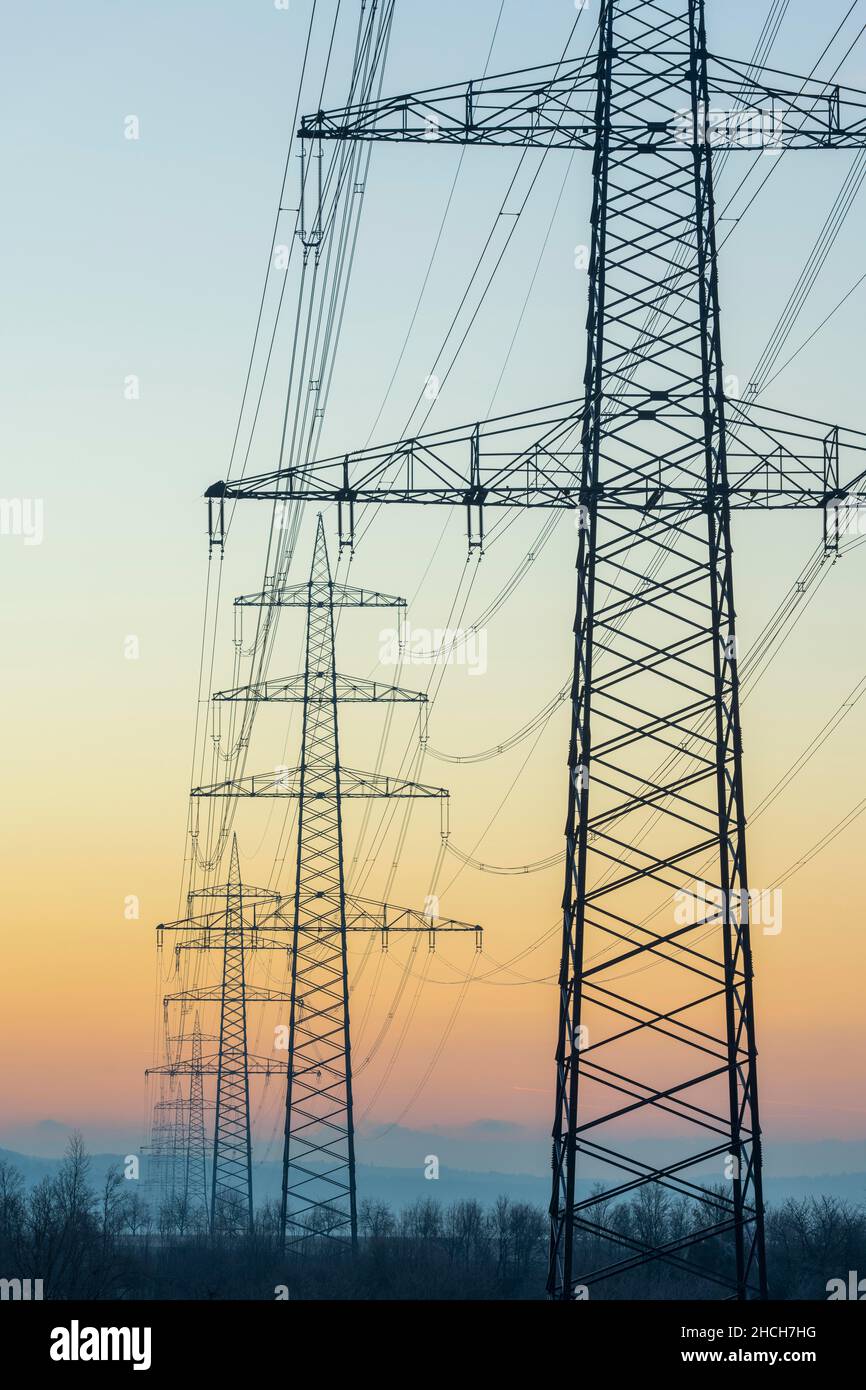 High-voltage pylons, overhead power lines, dawn, Baden-Wuerttemberg ...