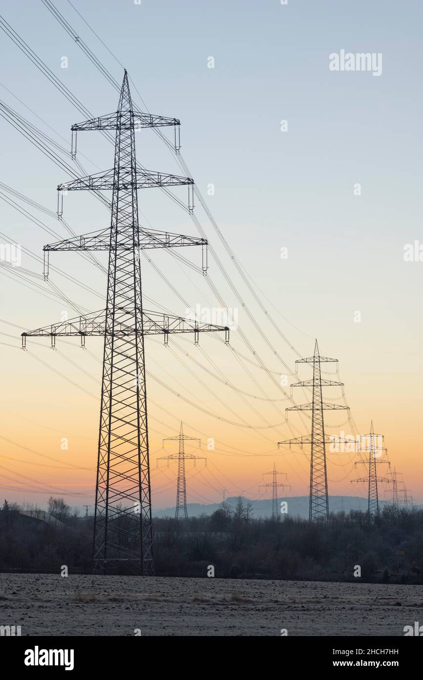High-voltage pylons, overhead power lines, dawn, Baden-Wuerttemberg ...