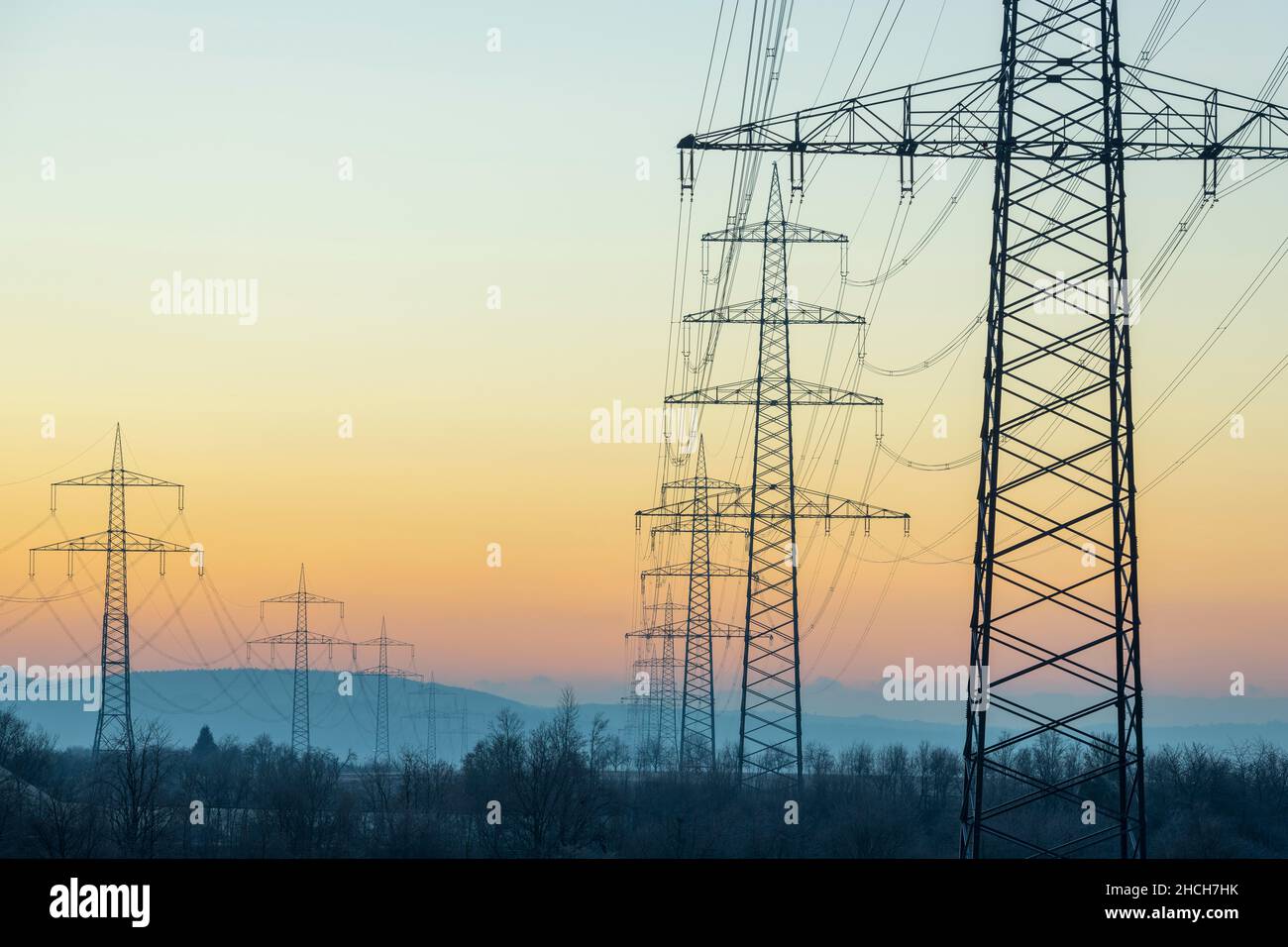 High-voltage pylons, overhead power lines, dawn, Baden-Wuerttemberg ...