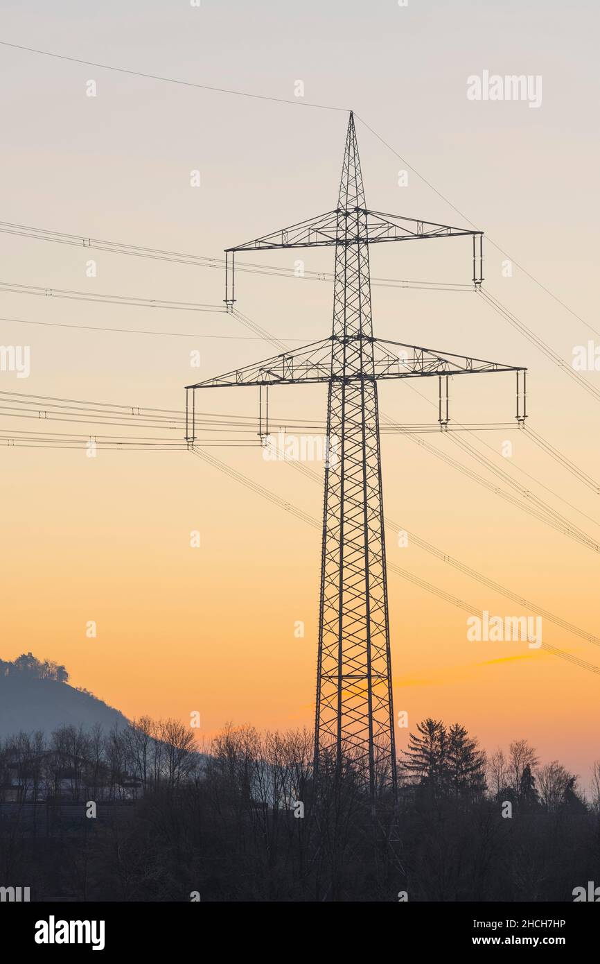 High-voltage pylons, overhead power lines, dawn, Baden-Wuerttemberg ...