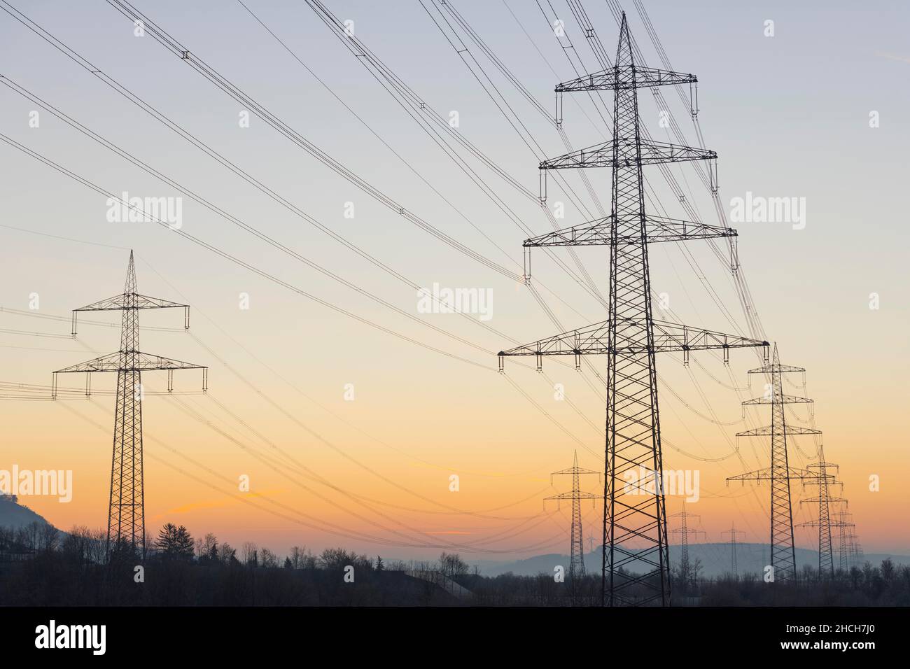 High-voltage pylons, overhead power lines, dawn, Baden-Wuerttemberg ...