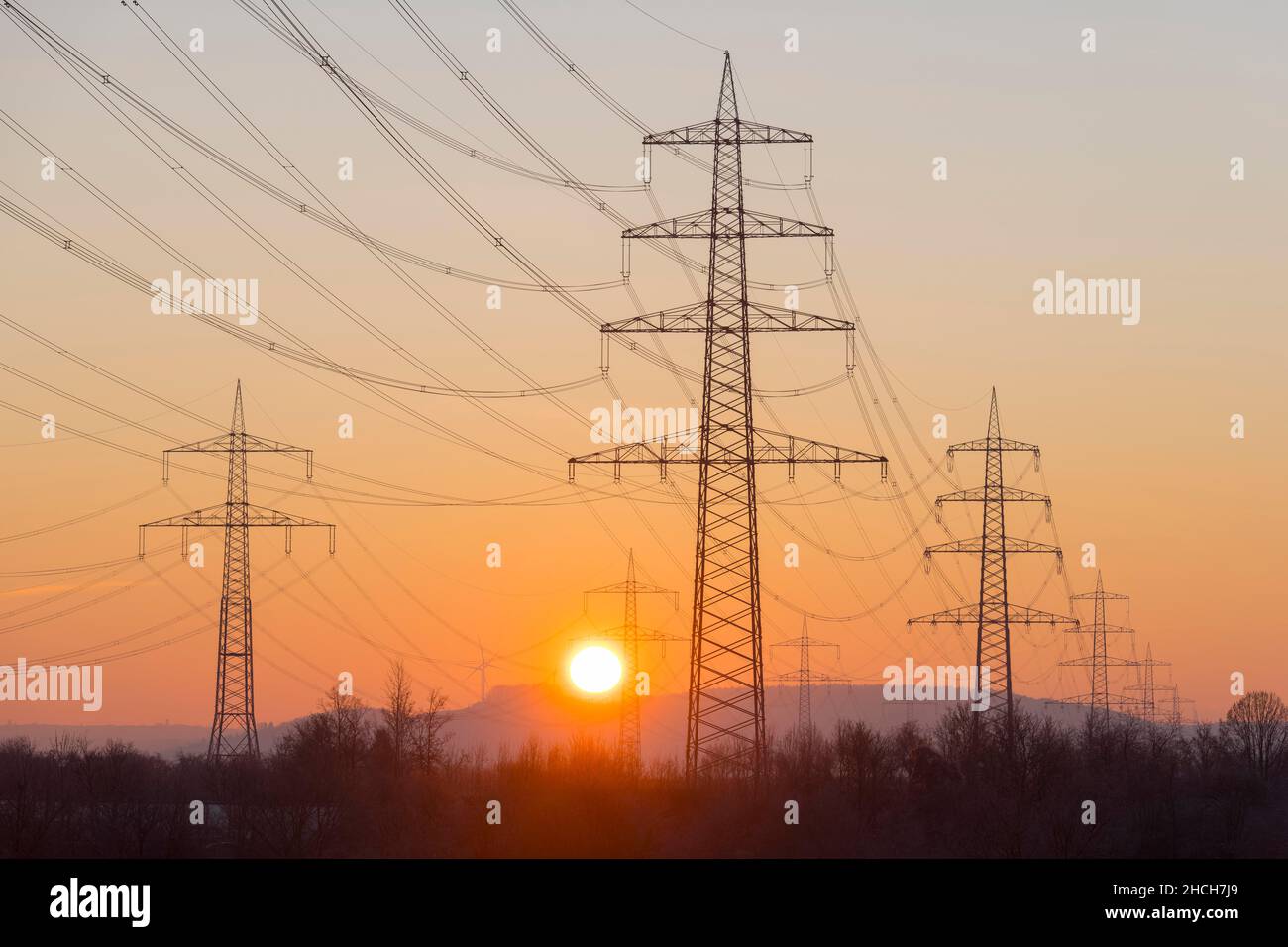 High-voltage pylons, overhead power lines, sunrise, Baden-Wuerttemberg ...