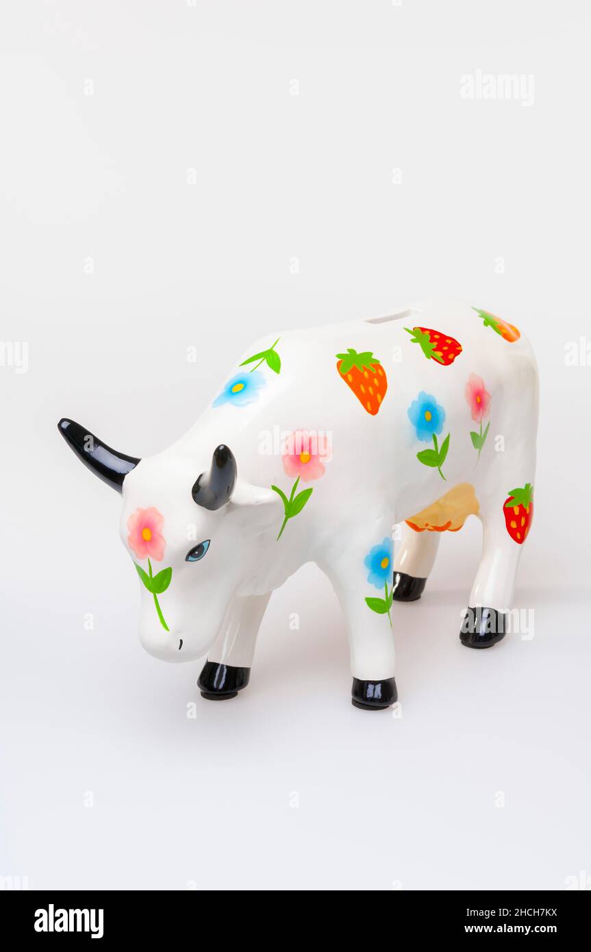 Porcelain money box, cow, flowers, strawberries Stock Photo - Alamy