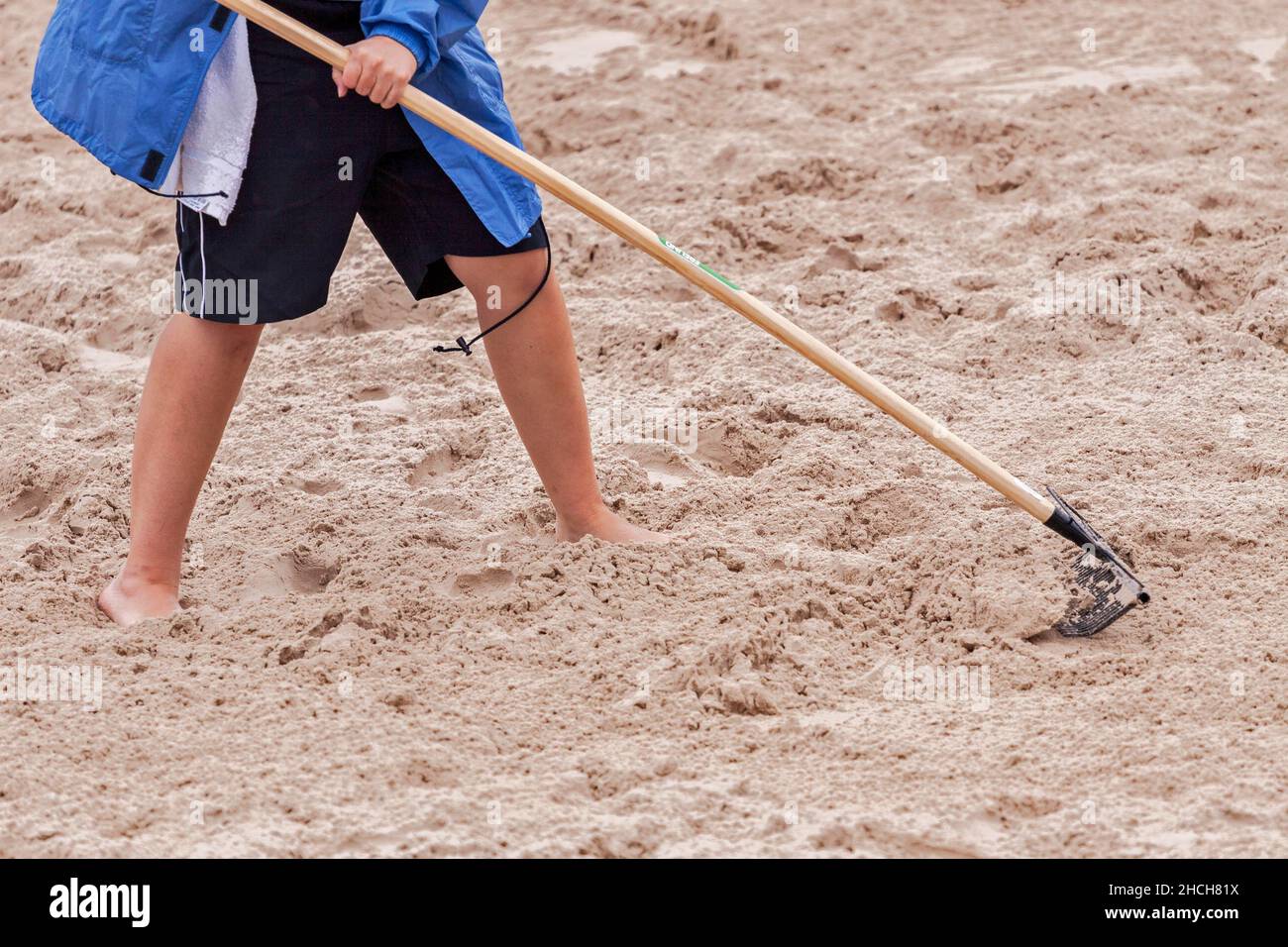 Raking the jumping pit for the long jump, Berlin, Germany Stock Photo ...