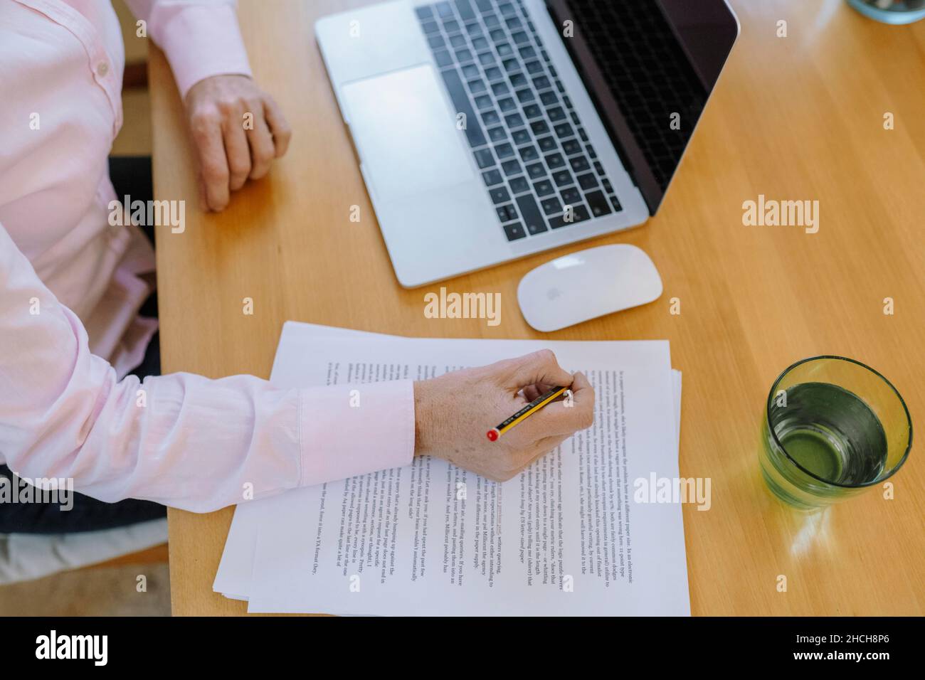 Woman proofreading at her desk Stock Photo - Alamy