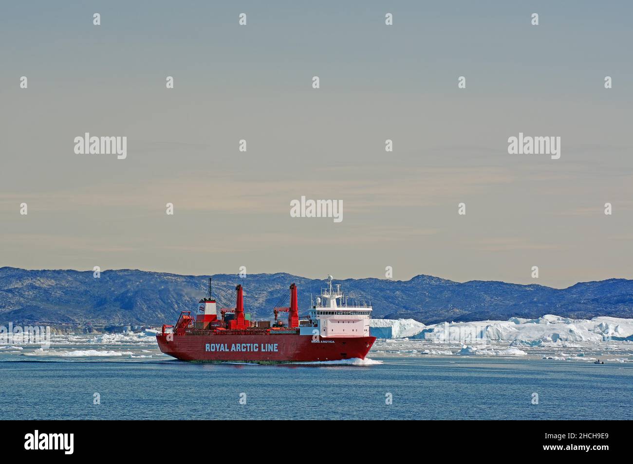 Royal Arctic Line supply vessel in front of icebergs, Disko Bay ...