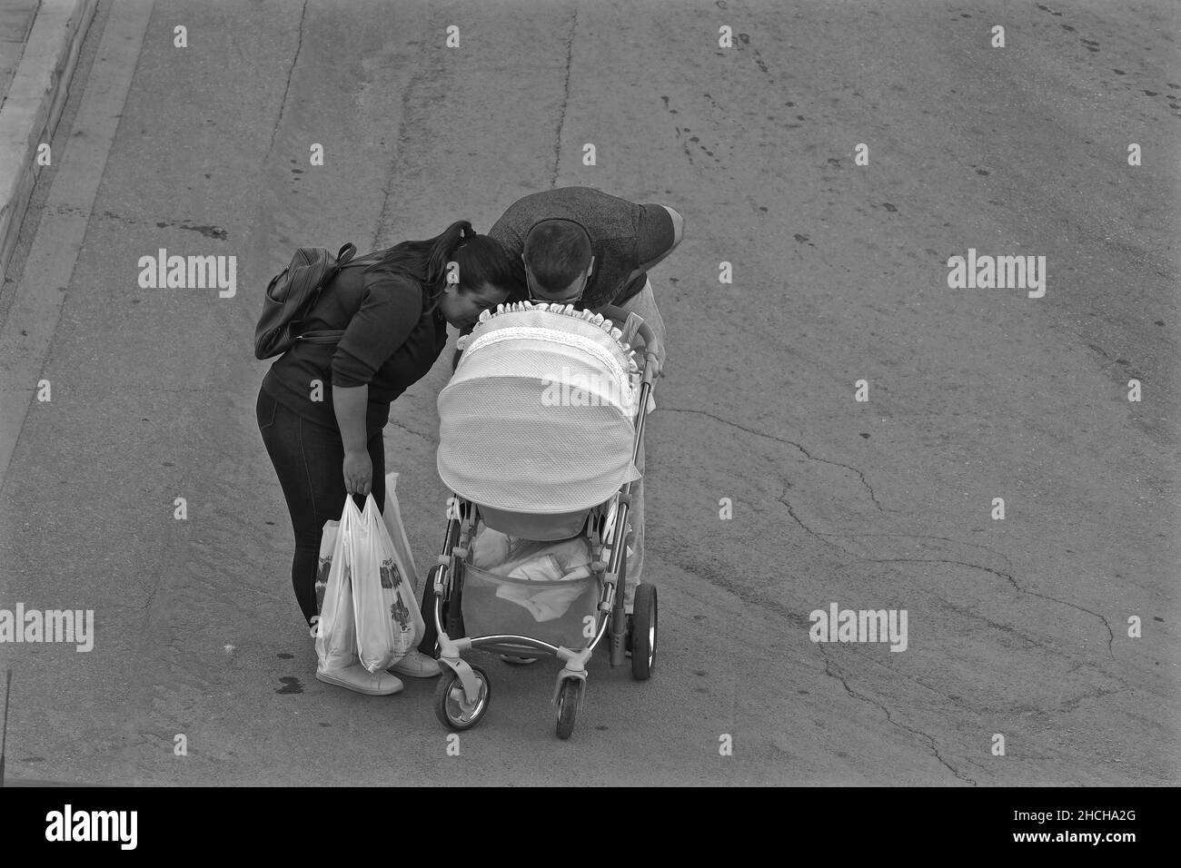 Young parents look rapt in prams, Spain Stock Photo - Alamy