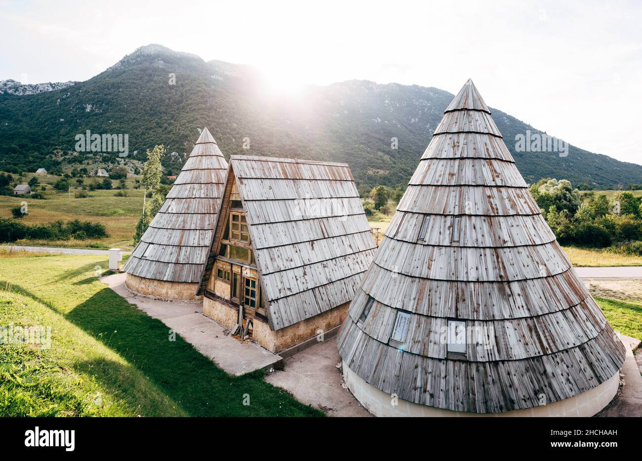 Triangular stone house between two conical buildings. Montenegro Stock ...