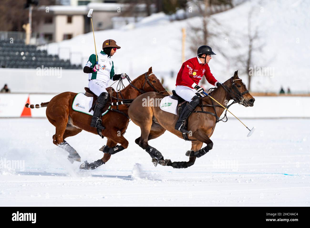 Max Charlton (red) of Team St. Moritz pursued by Santiago Marambio ...
