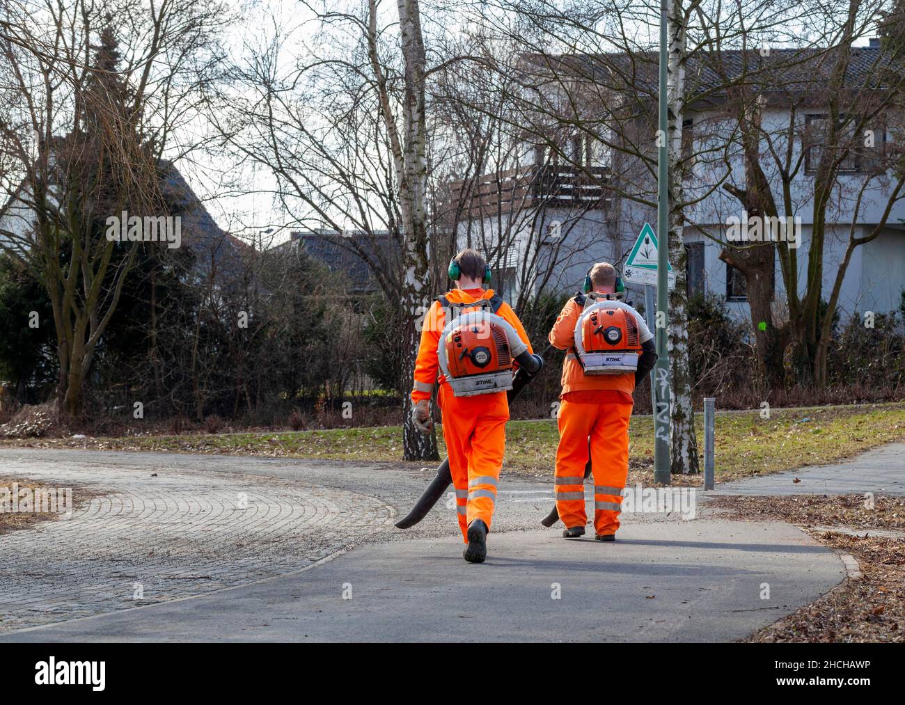 Employees of the horticultural office at work with the leaf blower ...