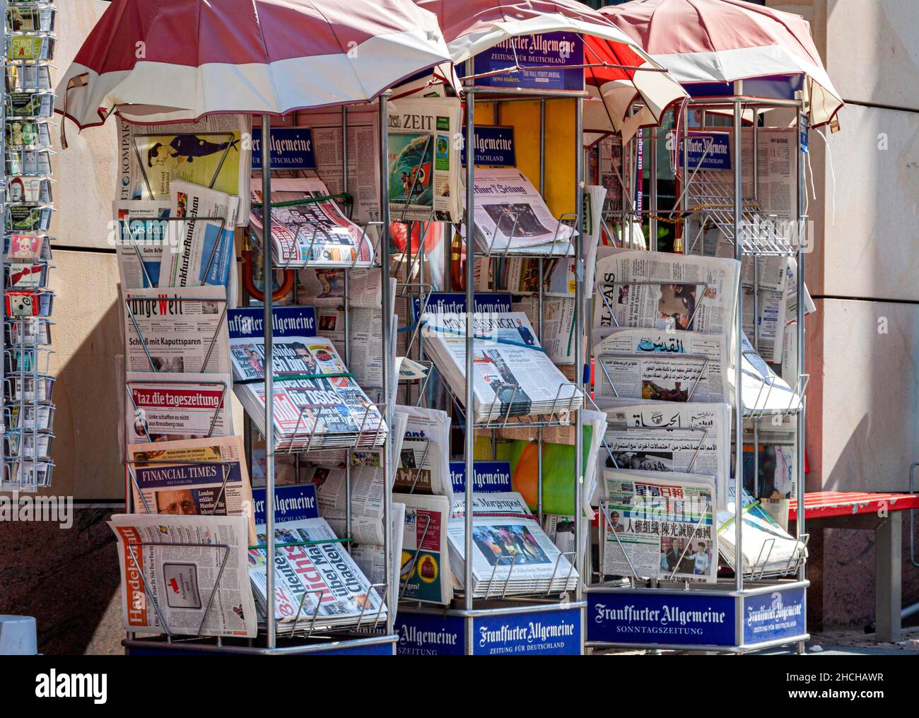 Daily newspapers and international press on display at the newsstand ...