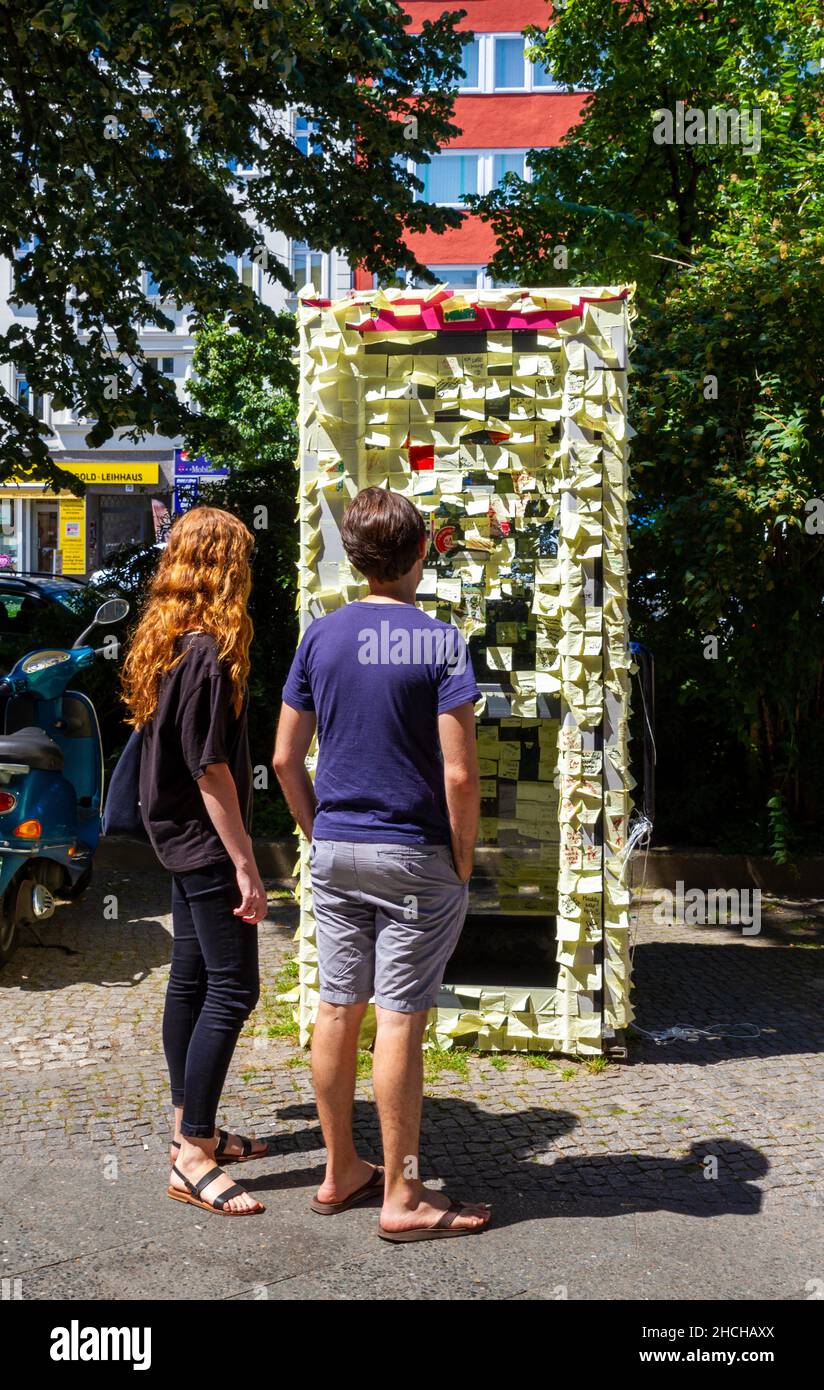 Telephone box taped up with Post it complete in Kreuzberg, Berlin ...