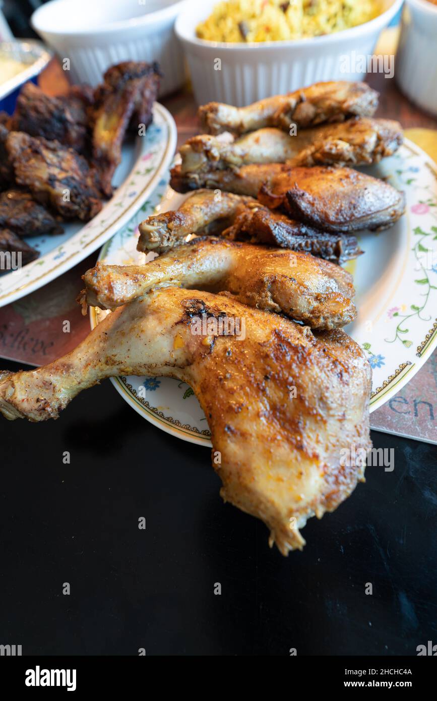 Grilled chicken thighs ready to eat on a buffet Stock Photo - Alamy