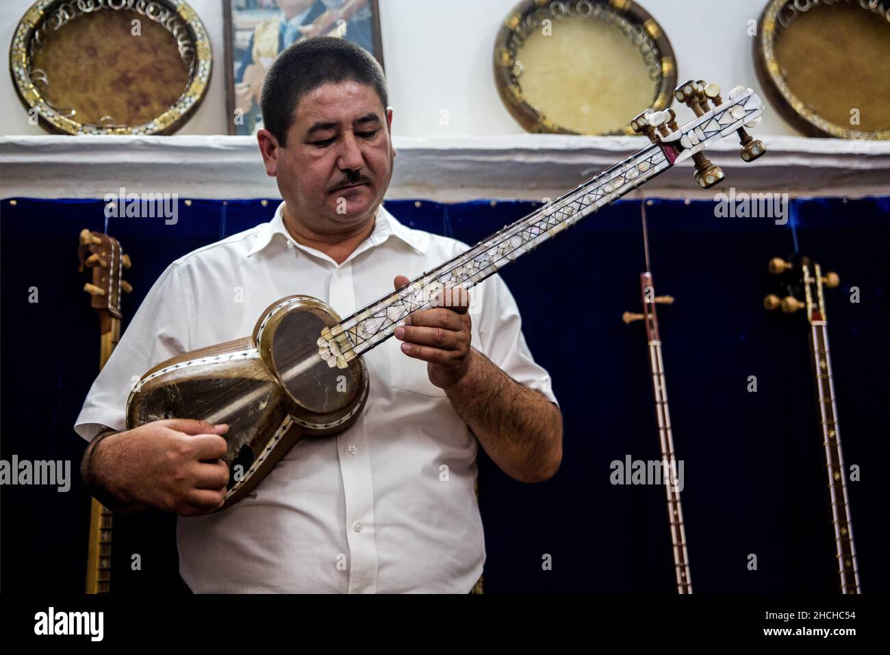 Musician with typical Uzbek musical instrument, Uzbekistan, Uzbekistan ...