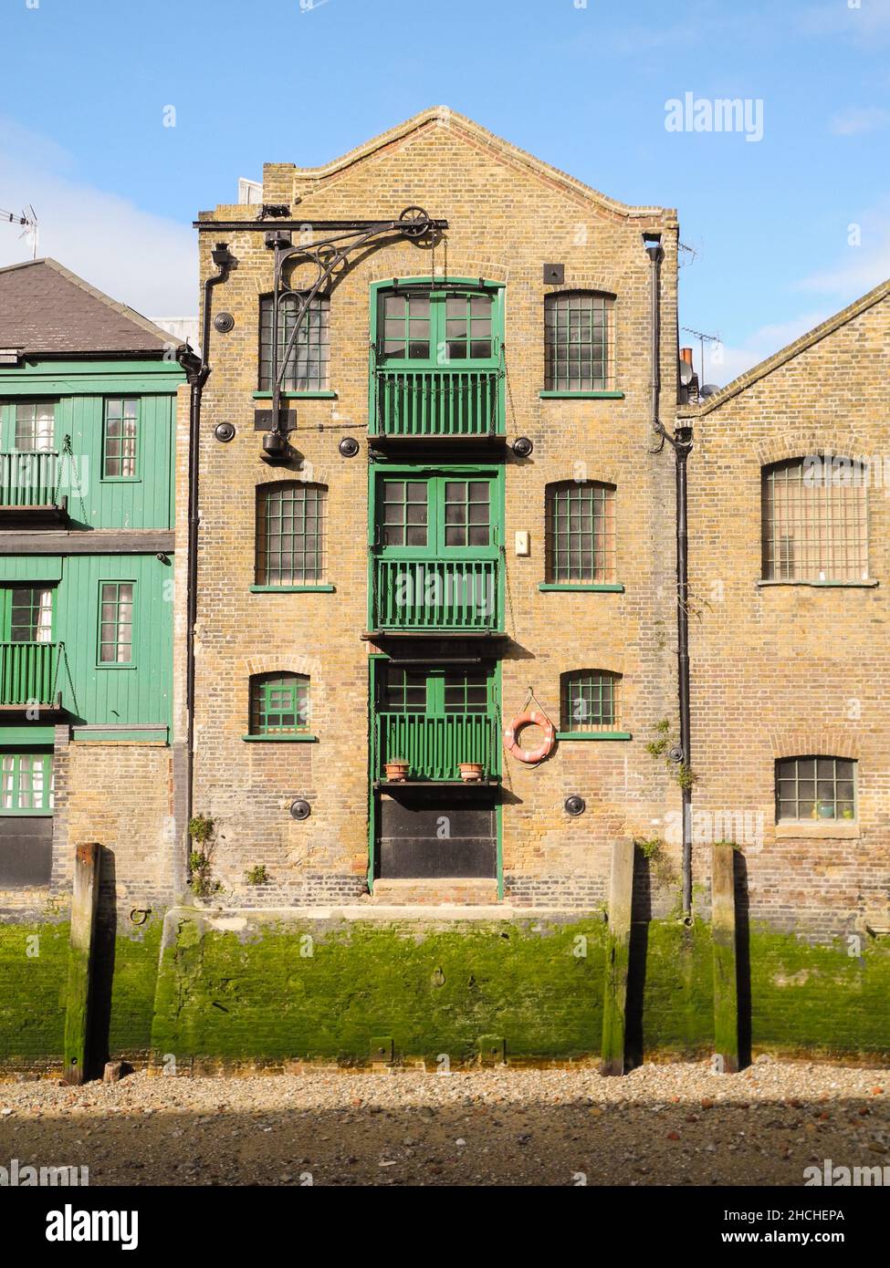 The exterior of an old warehouse and loading hoist at Dunbar Wharf ...
