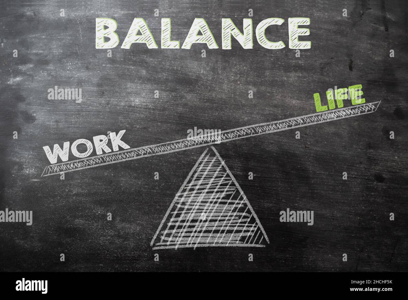 Life balance chart. The word work outweighs the word life. Chalk ...