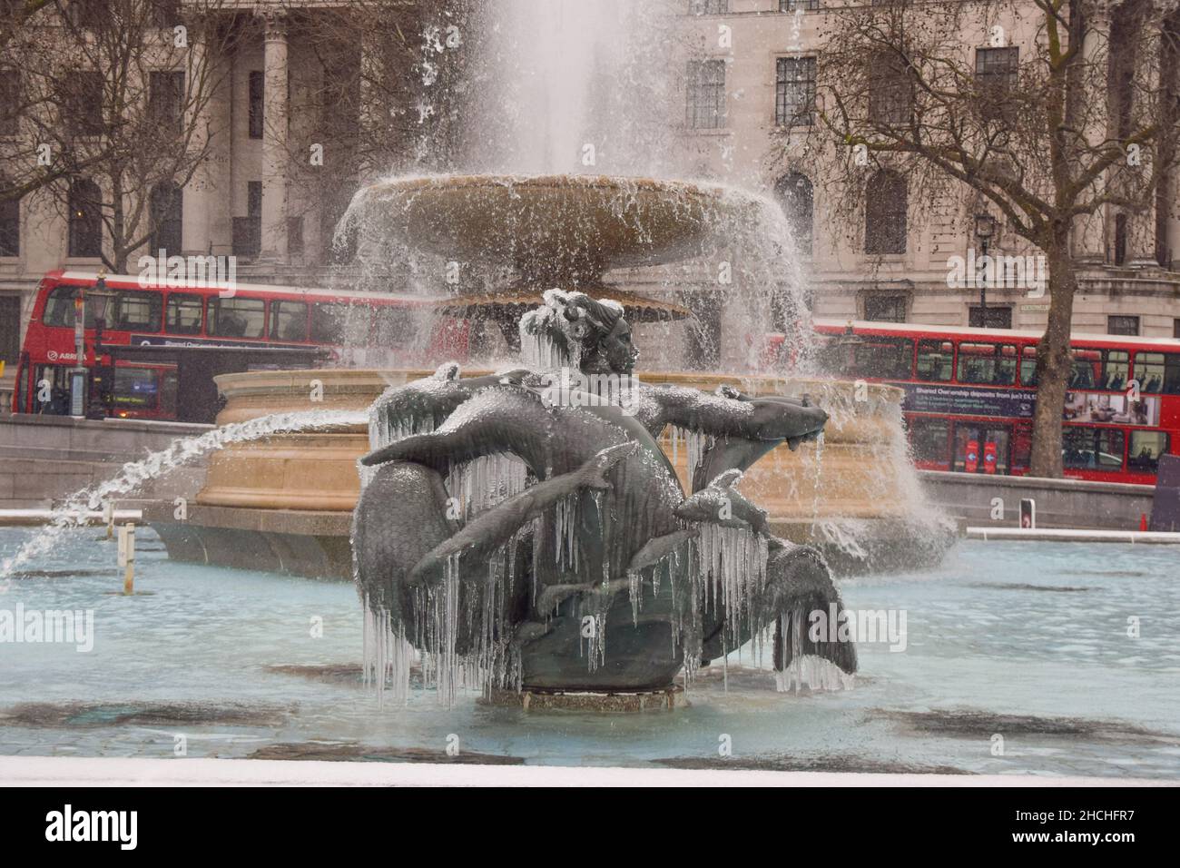Frozen fountain statue at Trafalgar Square, London, UK 11 February 2021 ...
