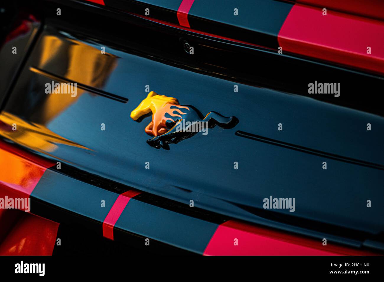 Closeup shot of a red and black Mustang fire logo Stock Photo - Alamy