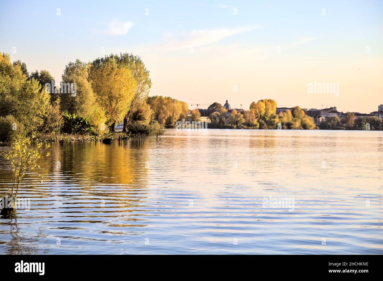 Shore at sunset that stretches on a river Stock Photo - Alamy