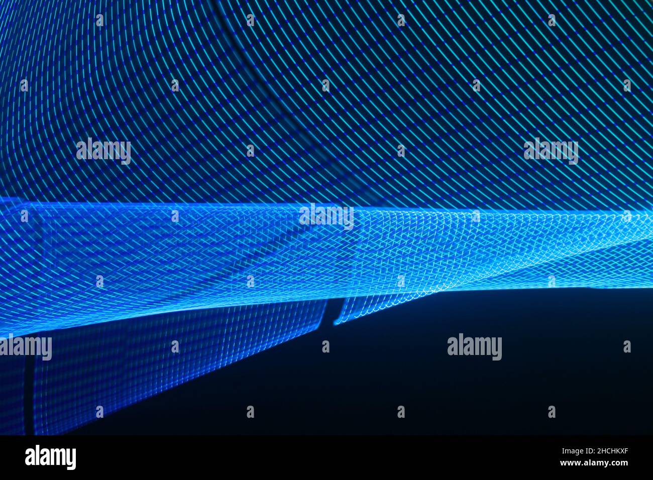 A dark blue pattern of electrons performing accelerated motion and ...