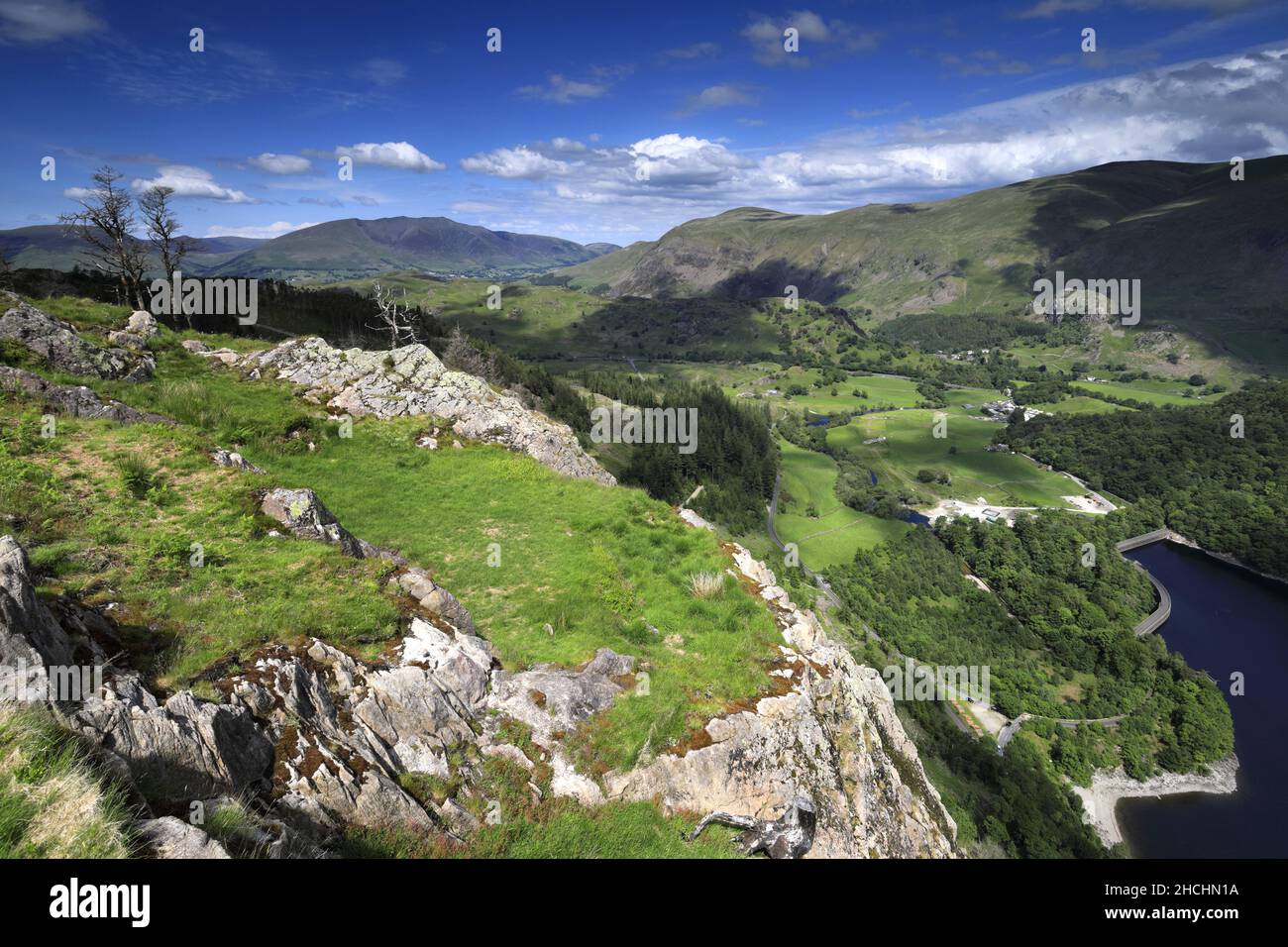 The summit cairn of Raven Crag fell overlooking Thirlmere reservoir ...
