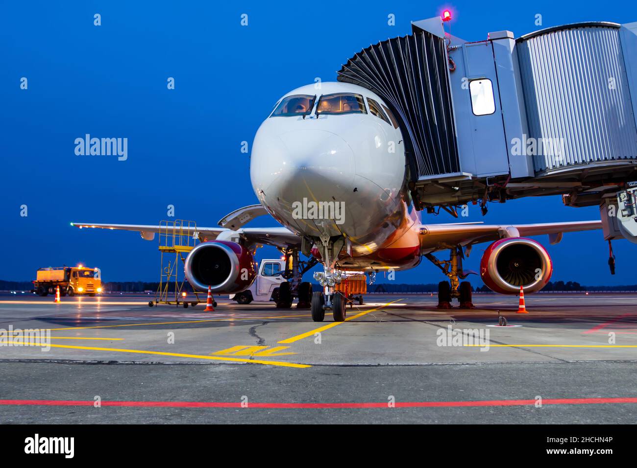 Ground handling of a passenger aircraft near the boarding bridge at ...