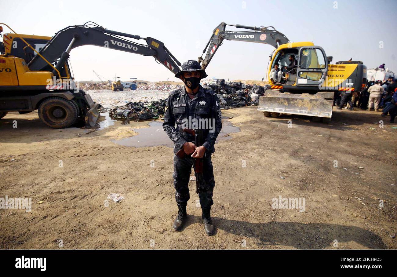 View of destroying liquor bottles and burning pile of confiscated drugs ...