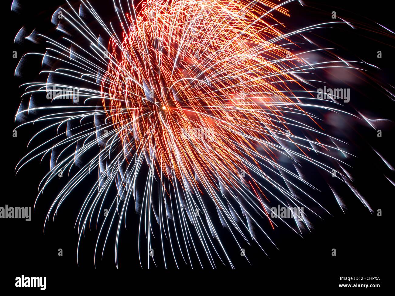 Flash of red and white fireworks on background black sky. Holiday ...