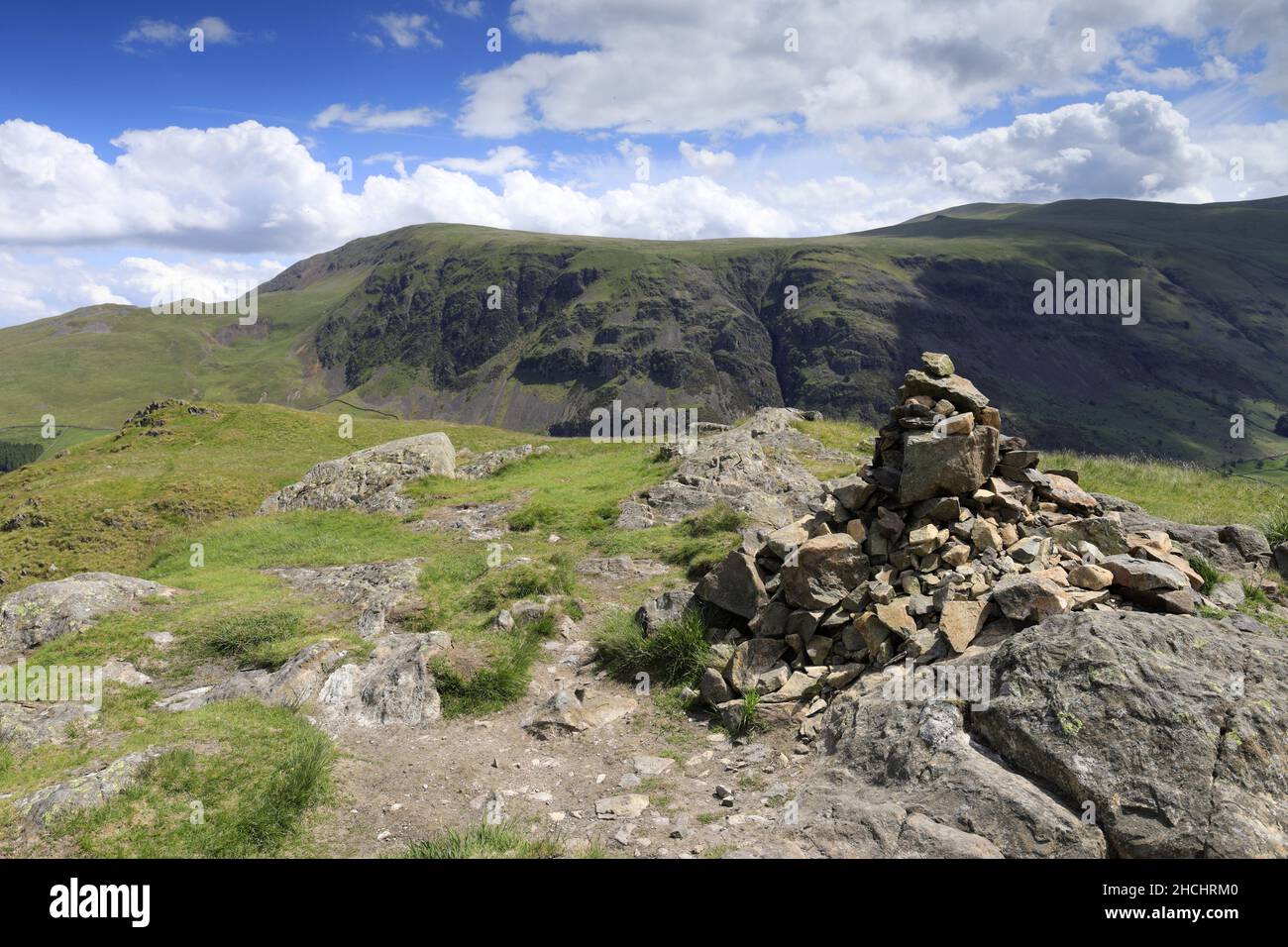 The summit cairn of High Rigg fell overlooking St Johns in the Vale ...